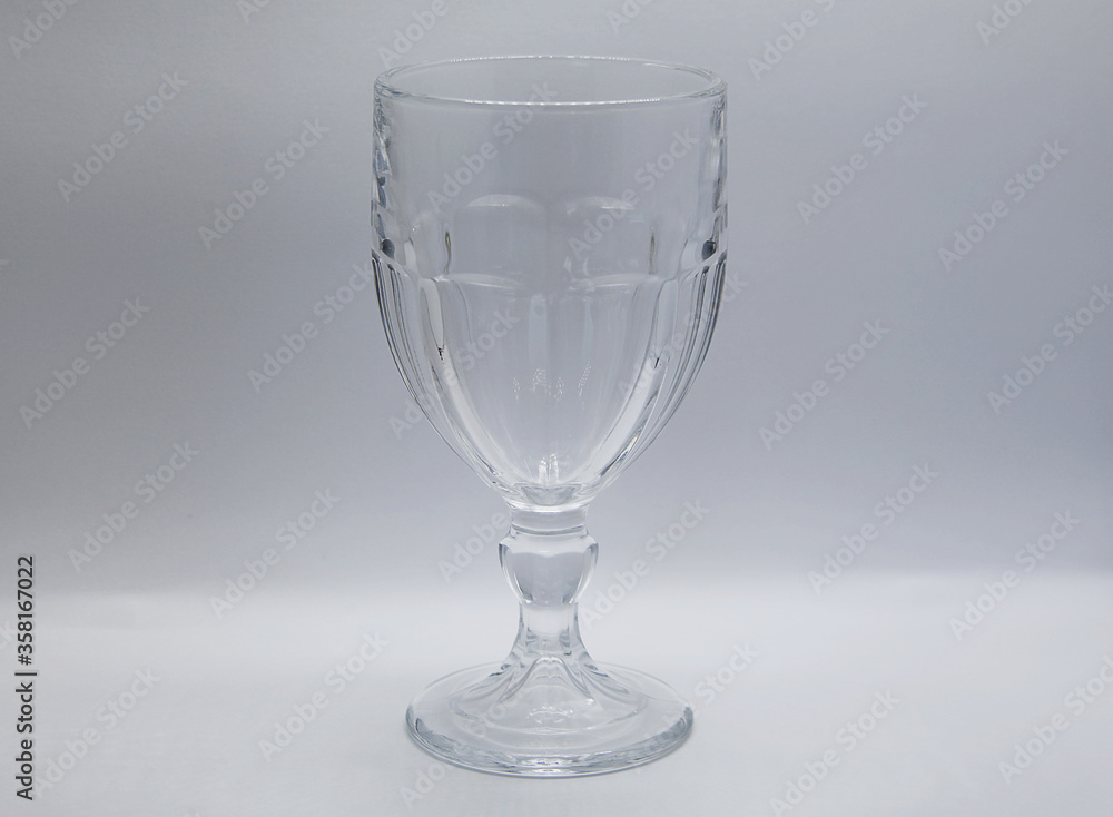 Cup with colorless glass feet and sculpted details, cylindrical and ...