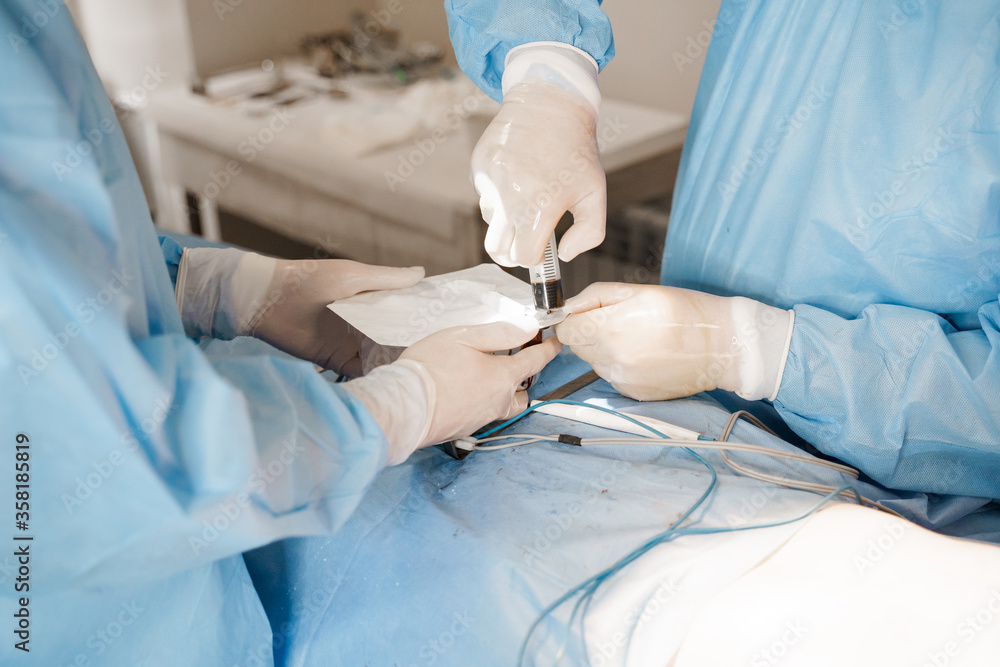 Surgeon open box and takes silicone implant. Chest augmentation plastic ...