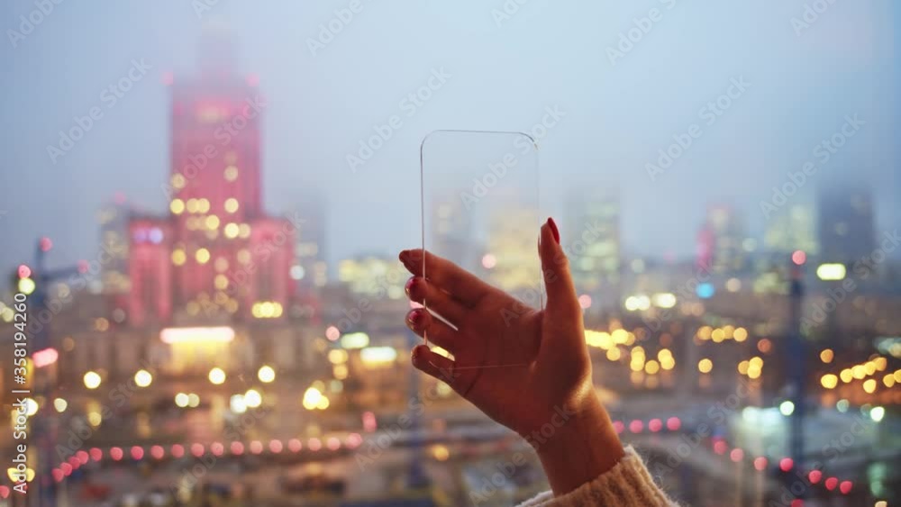 Female hand showing futuristic mock-up phone for animation. Closeup ...