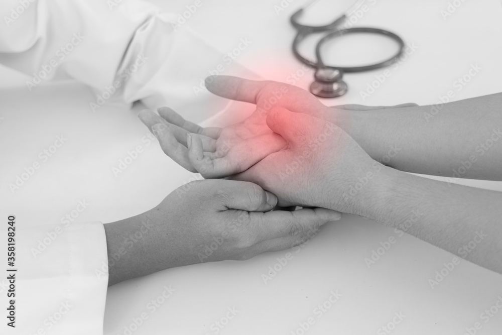 Black and white.Asian orthopaedic doctor doing physical examination in ...
