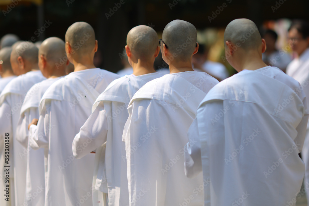 Buddhist nuns get offerings in the morning Stock Photo | Adobe Stock