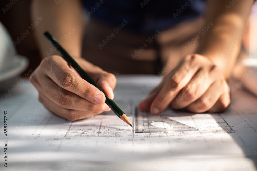 Architect working on blueprint. Architects workplace - architectural ...