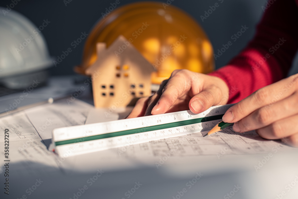 Architect working on blueprint. Architects workplace - architectural ...