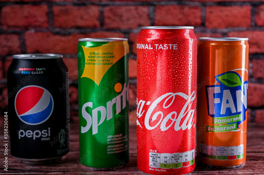A can, tin of fresh Coca Cola, sprite, fanta and pepsi drink with brick ...
