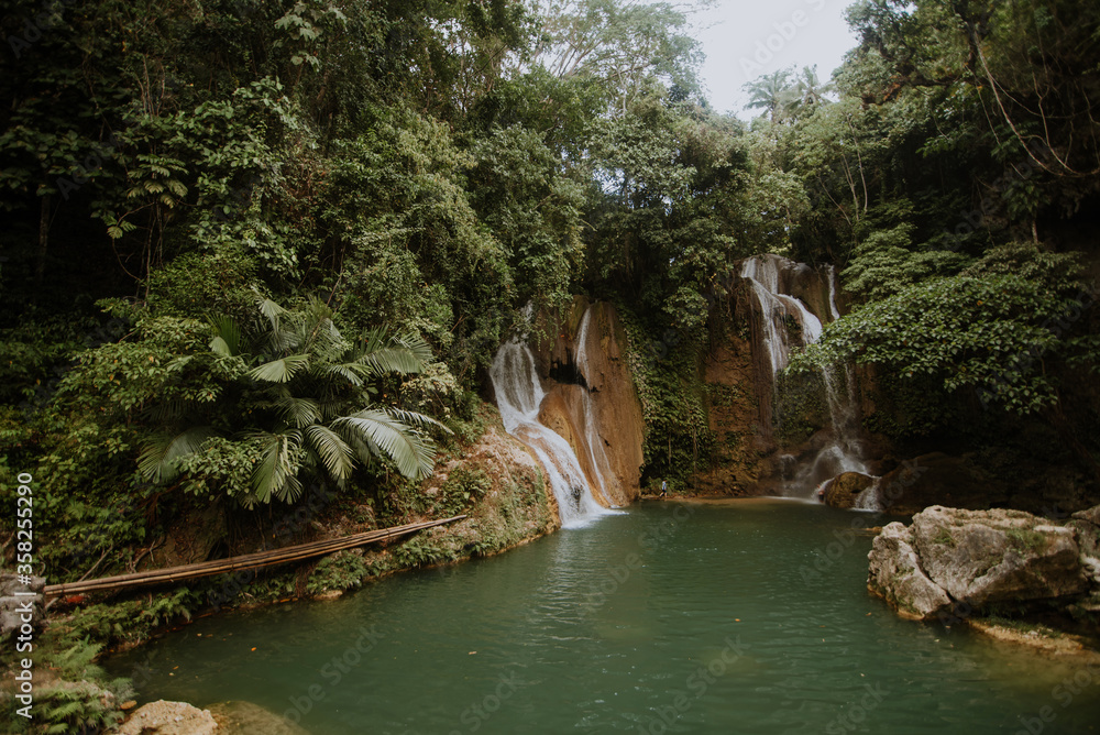 nature stamp with a beautiful waterfall on the island of bohol in the ...