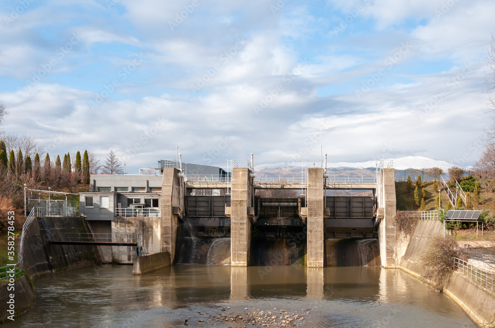 Small hydroelectric dam on a small river. Renewable power sources are ...
