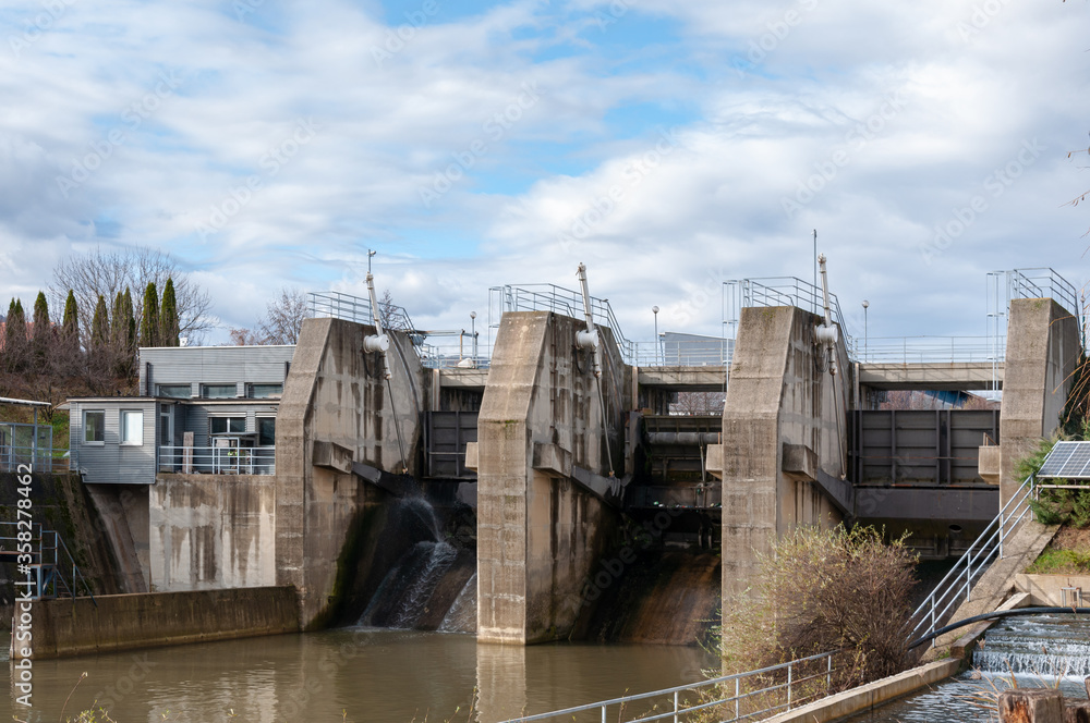 Small hydroelectric dam on a small river. Renewable power sources are ...