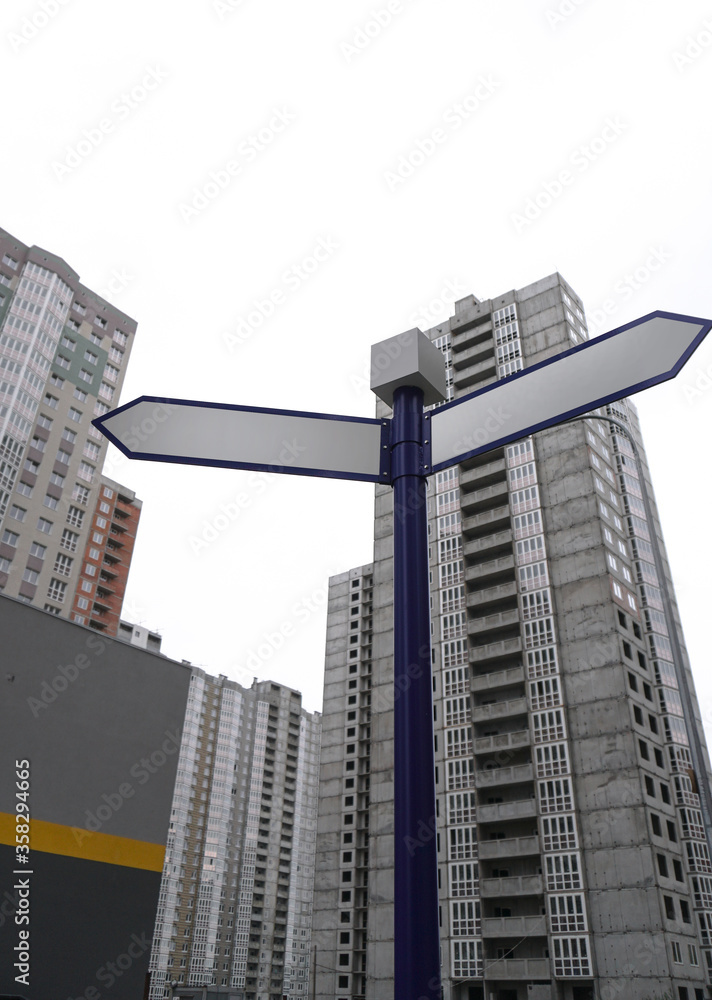 Signposts and markings on the background. Large construction site on a ...