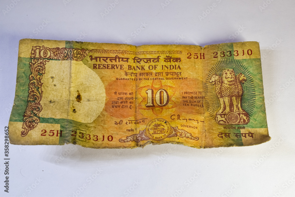 Old 10 rupees Indian currency note on white background. Stock Photo ...