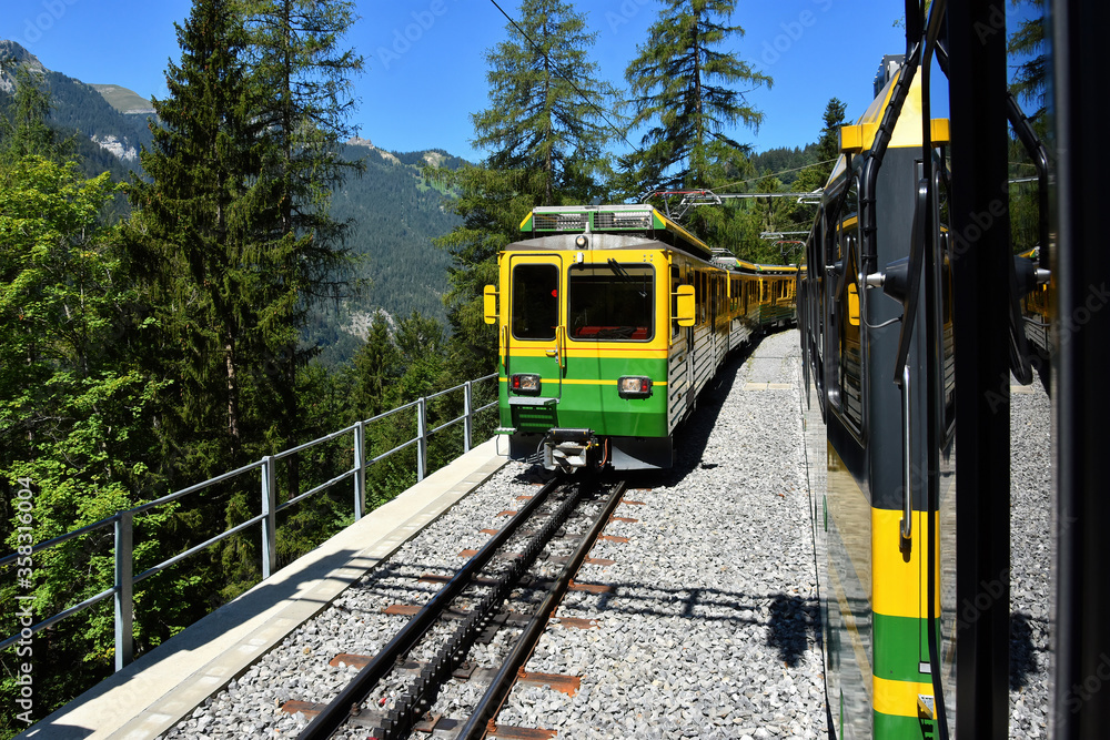 Beautiful scenery with yellow and green train - Bernese Highlands ...