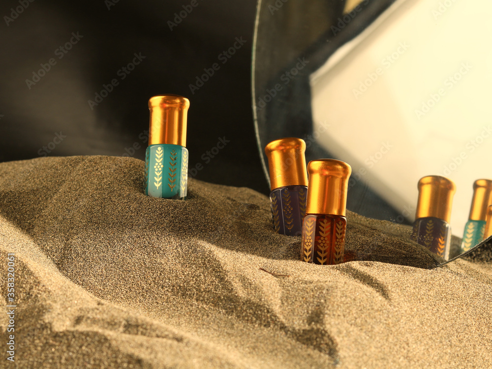 Arabian oud attar perfume in mini bottles. Stock Photo | Adobe Stock