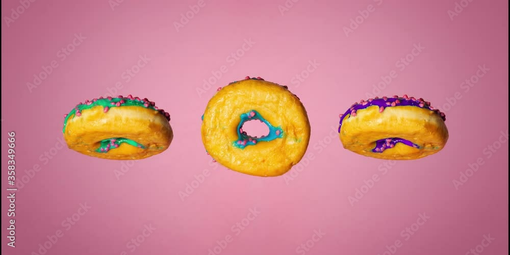 Rotating a blue donut on a pink background for any purposes. Creative ...