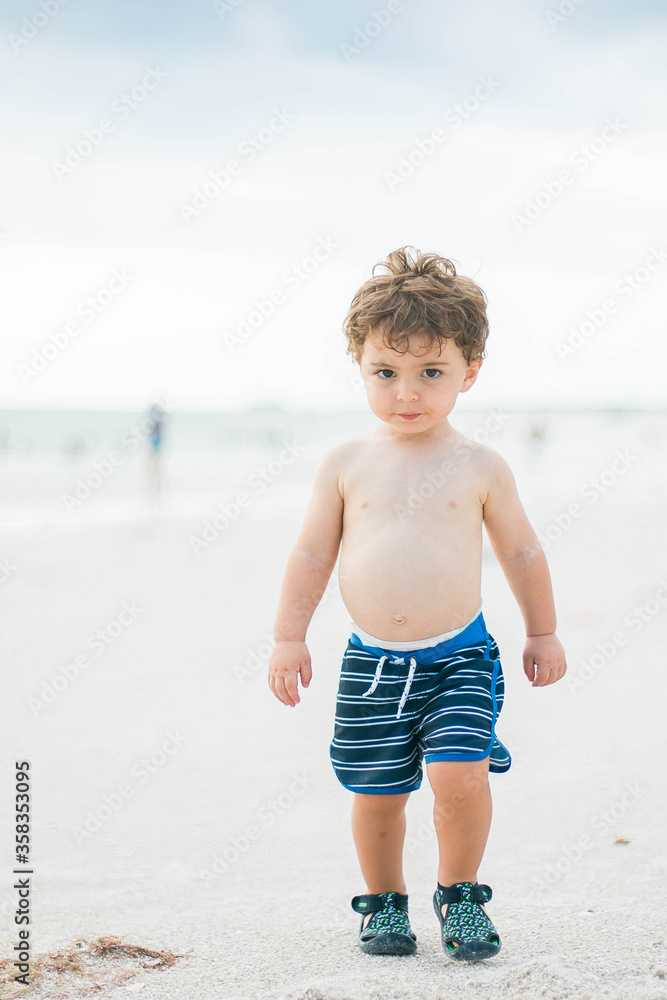 little boy on the beach in Marco island beach walking on the sand Stock ...