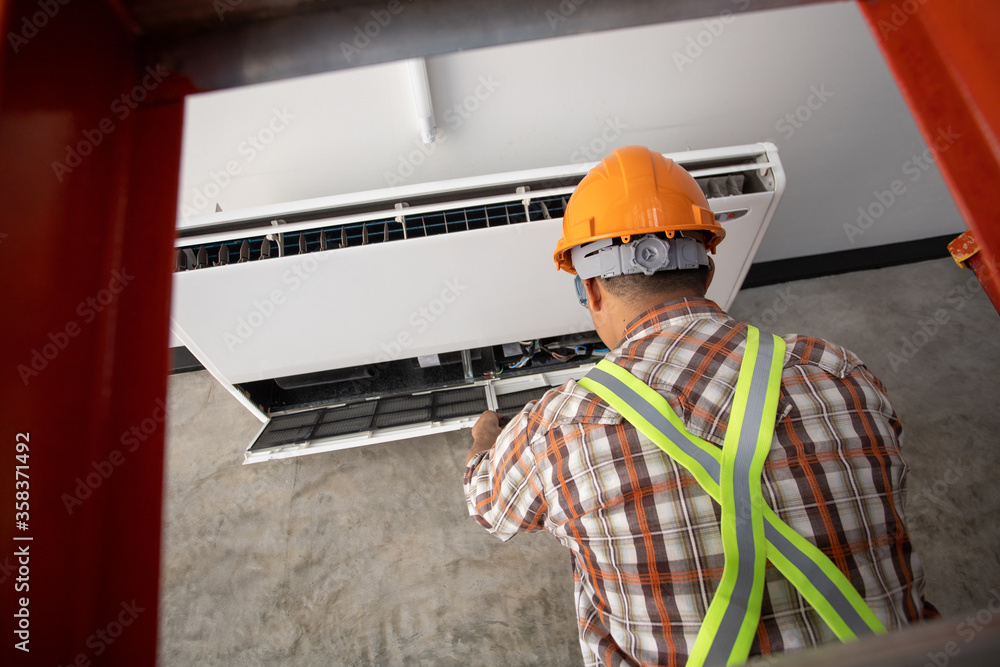 Air Conditioning Technician and A part of preparing to install new air ...