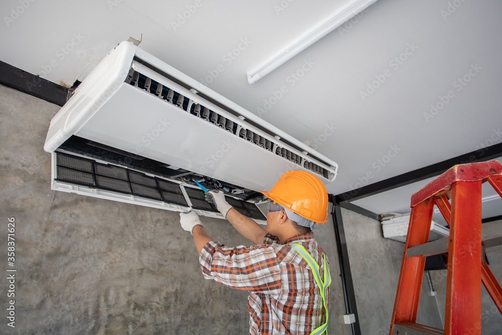 Air Conditioning Technician and A part of preparing to install new air ...