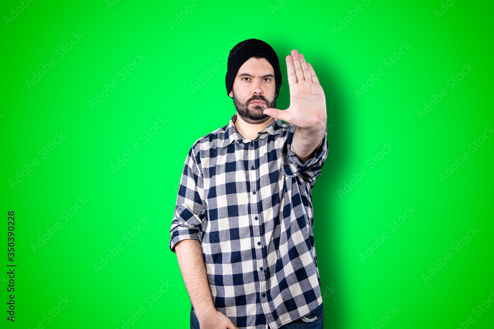 Closeup portrait serious young bearded man showing loser sign on ...