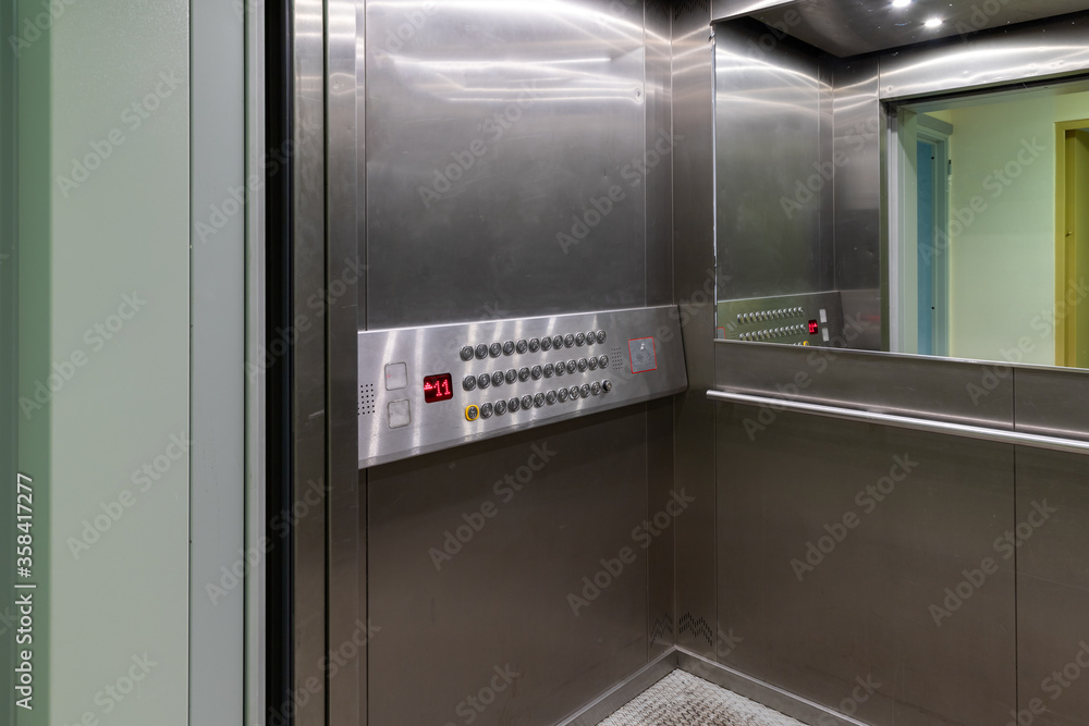 Elevator, with wide doors, adapted for wheelchair users, with a low ...