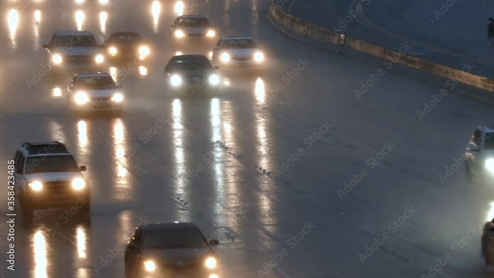 Traffic passing through rain downpour on the 118 freeway in the ...