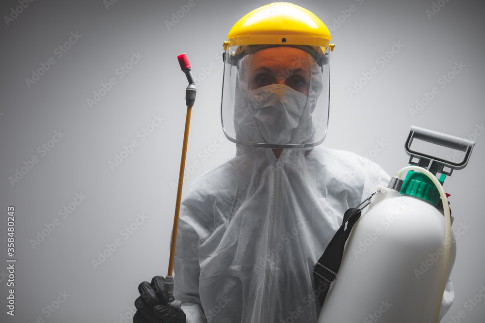 Scientist holding chemical sprayer for sterilization and ...