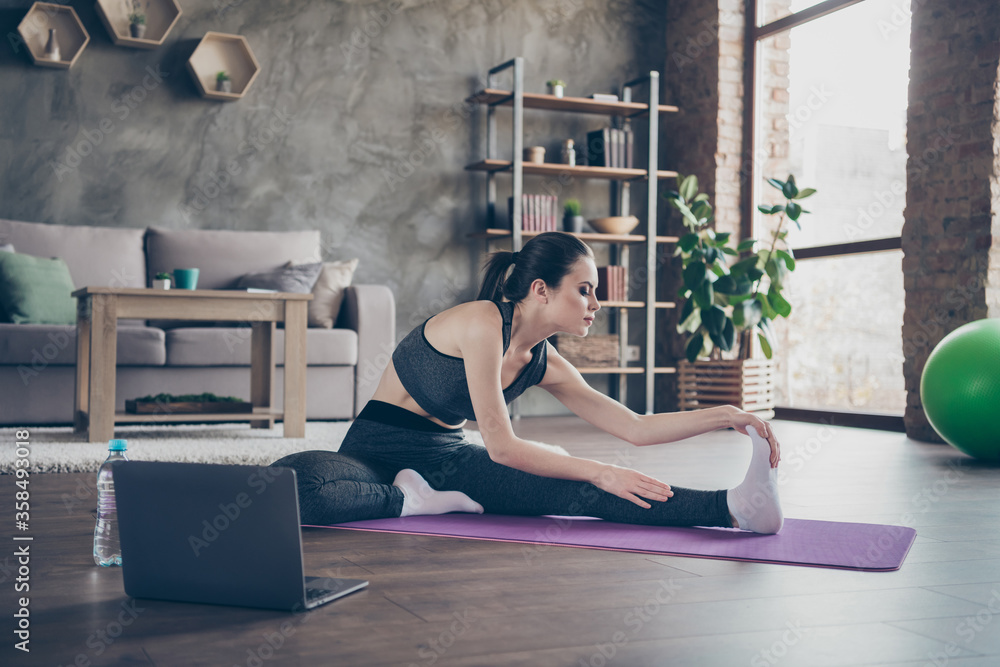 Full length profile side photo of focused beautiful sporty woman watch ...