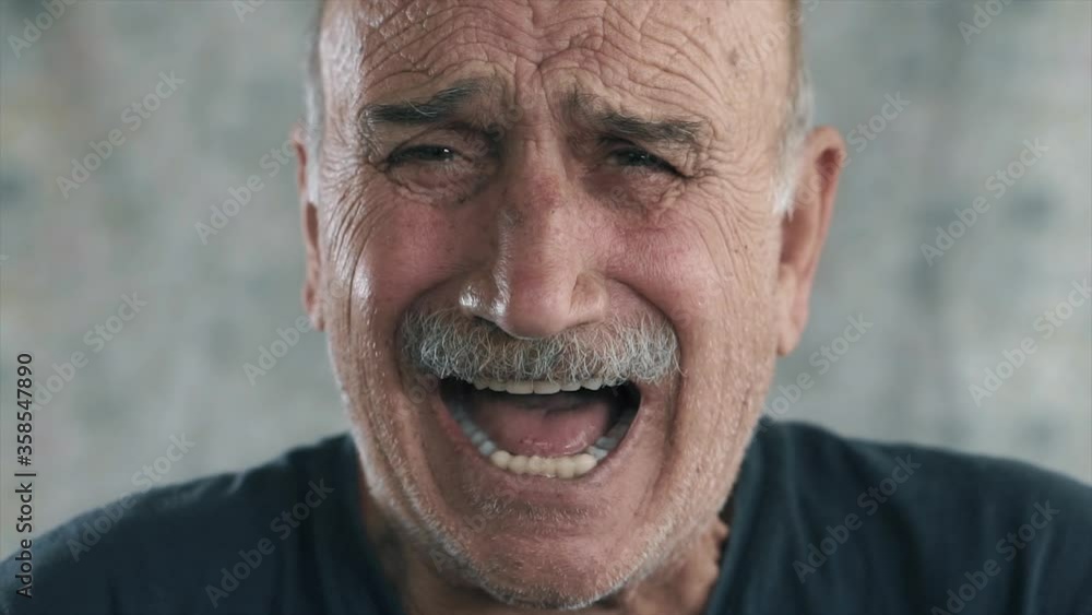 An old man screaming, depressed elderly face. Crying and in sad aged ...