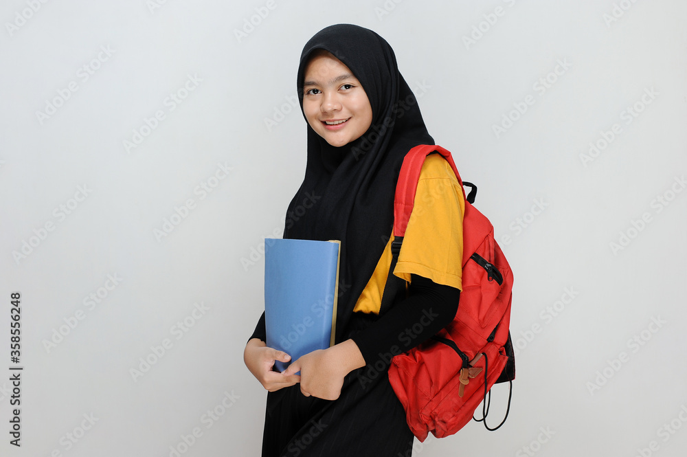 Smiling Muslim Teenager student wearing traditional clothes with ...