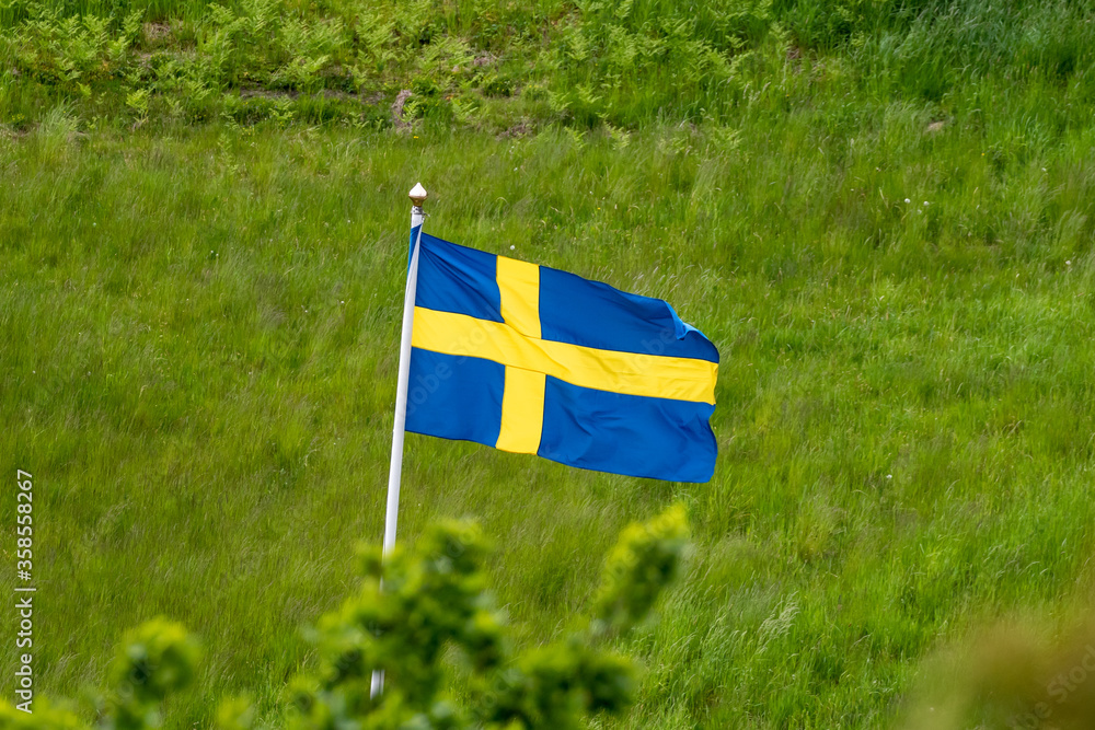 Swedish flag waiving in the wind on Swedens national day 6th June with ...