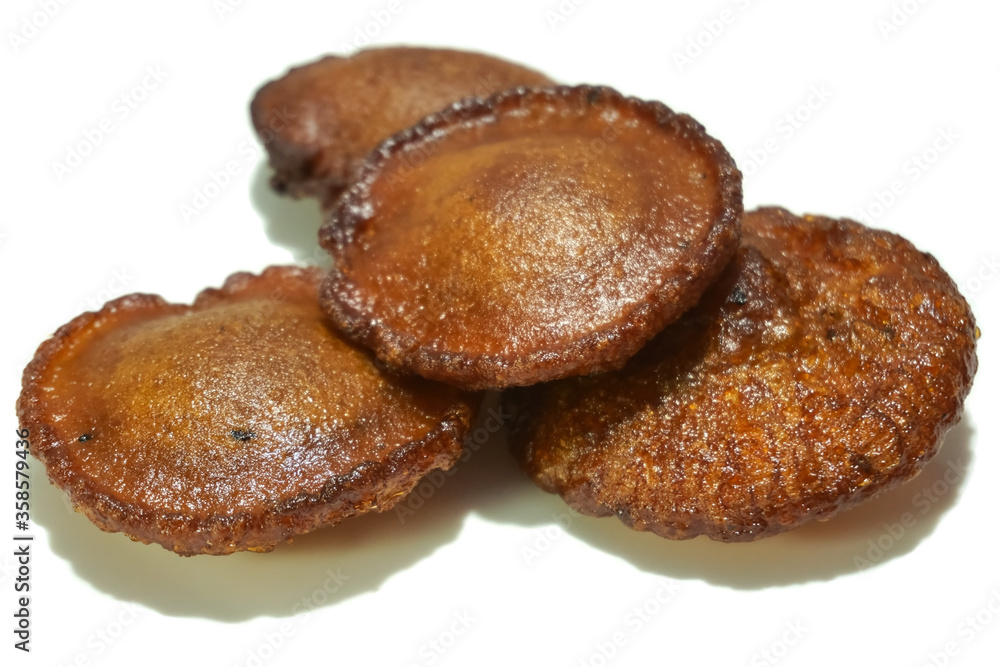 Traditional sweet snack from Kerala called Neyyappam isolated on a ...