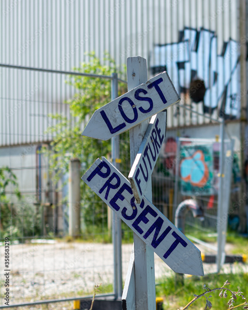 abstract sign showing lost, future and present headings. Located at a ...