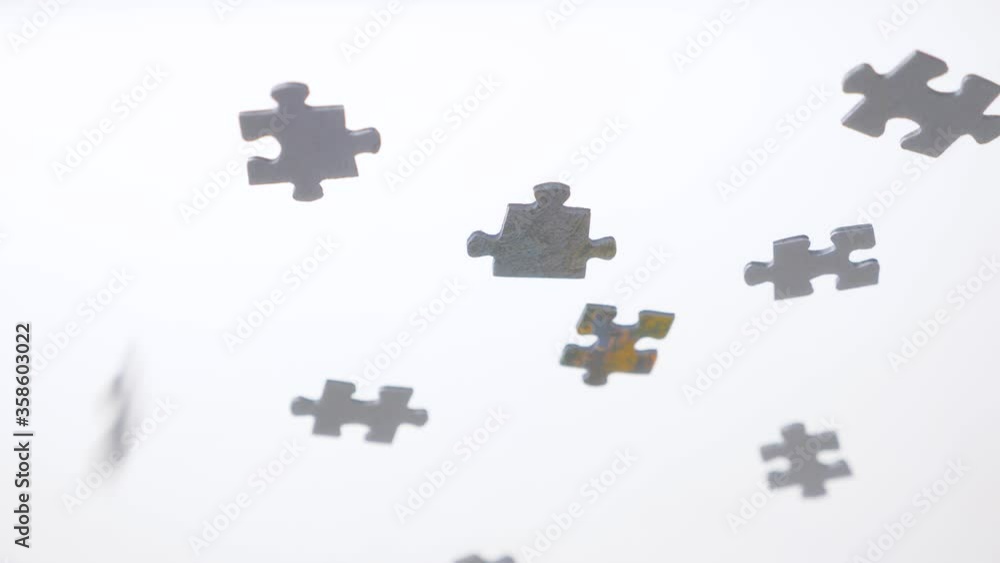 Pieces of puzzle falling down. Conceptual. Multitasking concept. Part ...