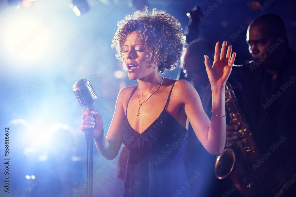 Black female Singer Performing on stage Stock Photo | Adobe Stock