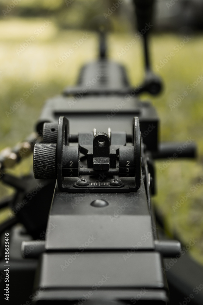 Rear sight of M249 light machine gun with 7.62 mm cartridge belt Stock ...