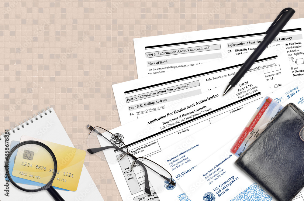 USCIS form I-765 Application for employment authorization lies on flat ...
