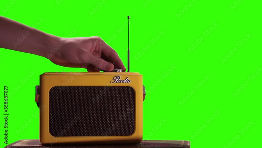 Young Male Hand tuning Old Radio on Green Screen. You can replace green ...