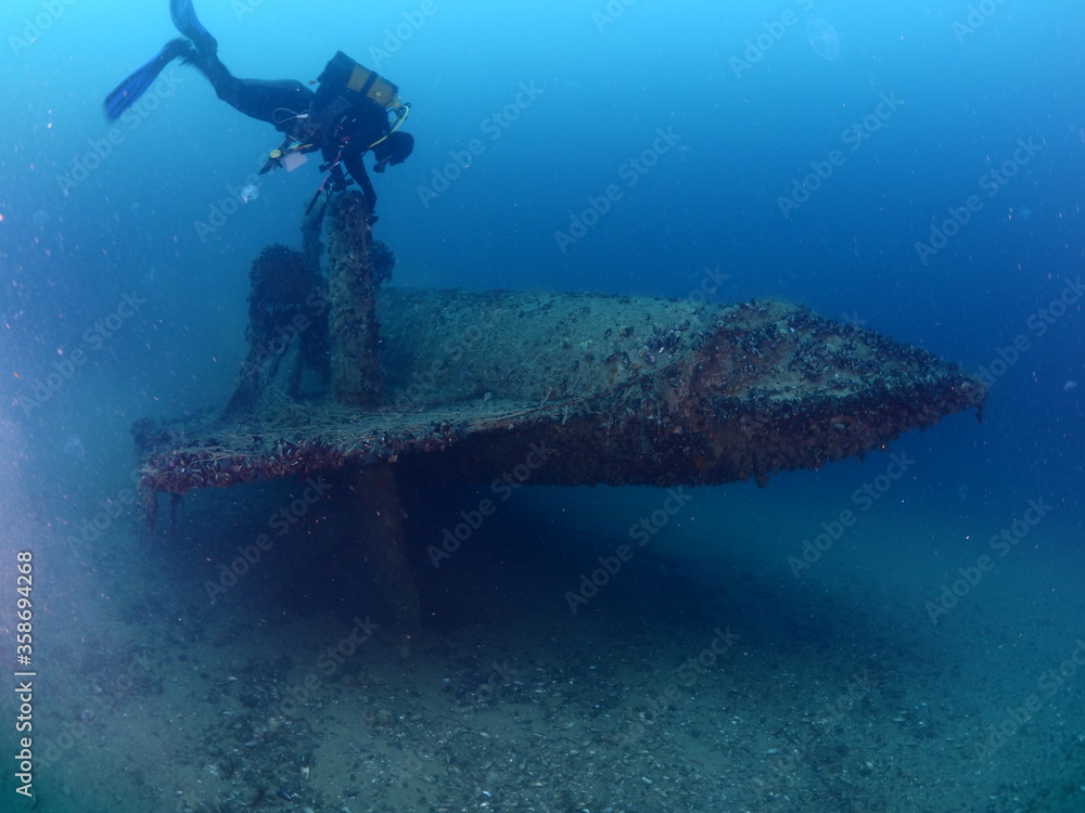 Scuba Divers Exploring Shipwreck Underwater U Boat Submarine From World scuba-divers-exploring-shipwreck-underwater-u-boat-submarine-from-world