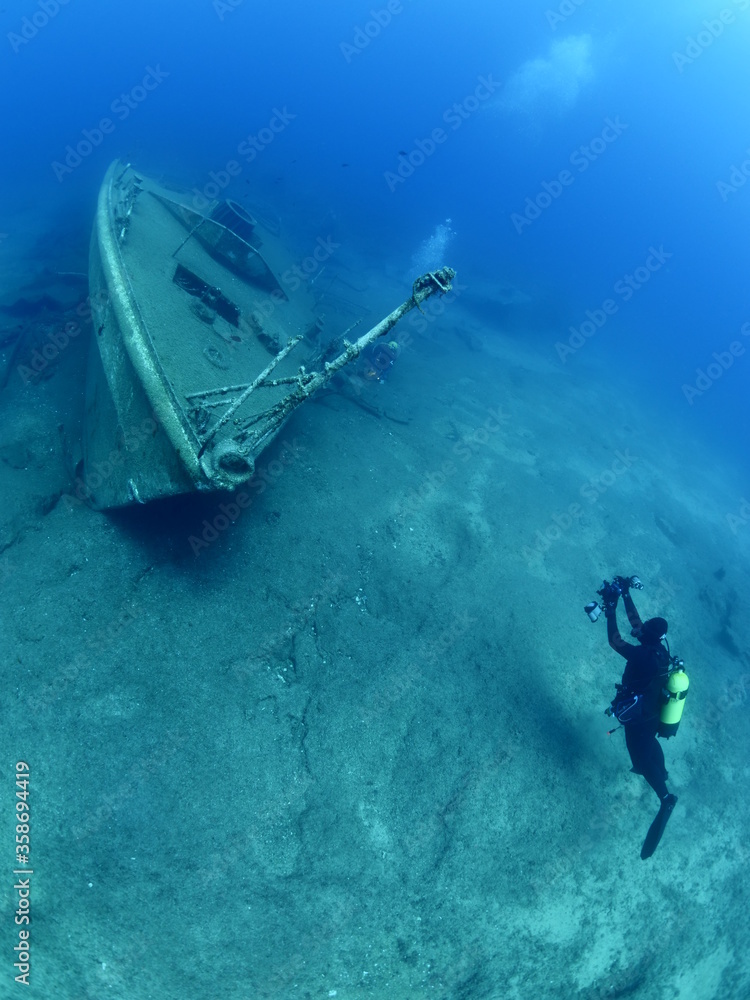 wreck dive underwater fish around ship wreck metal on ocean floor with ...