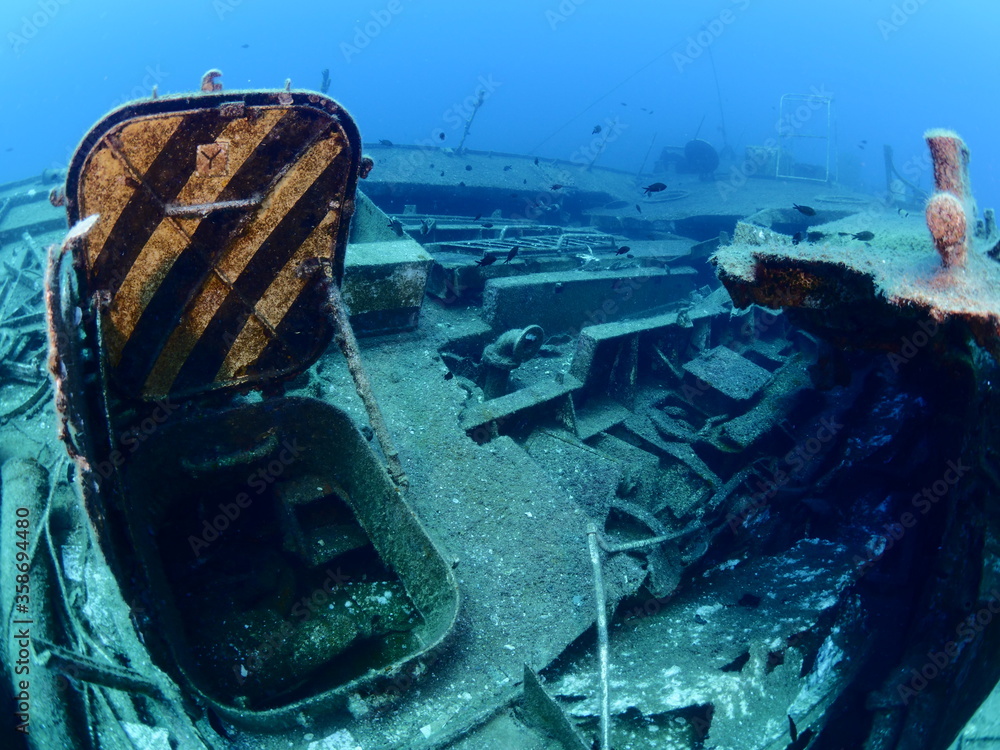 wreck dive underwater fish around ship wreck metal on ocean floor with ...