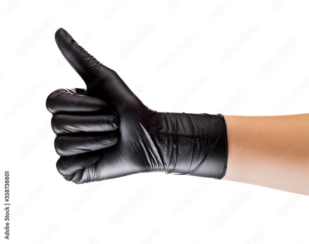 Hand in black glove showing gesture of like sign, giving thumb up on ...