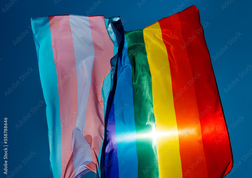 gay and transgender pride flags waving on the sky Stock Photo | Adobe Stock