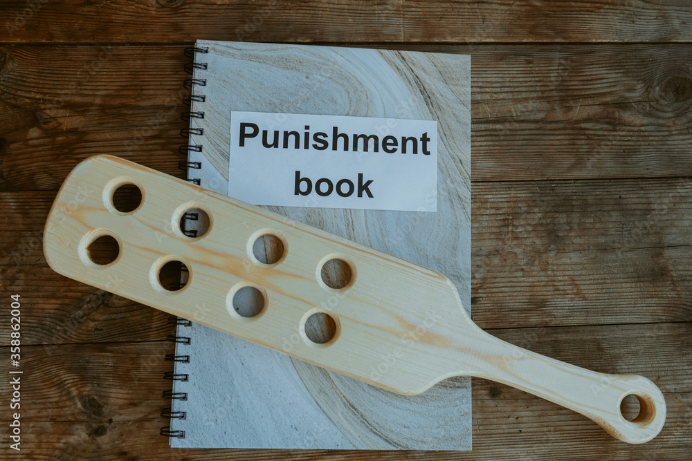 Punishment book. Wooden paddle for spanking on headmaster's or teacher ...