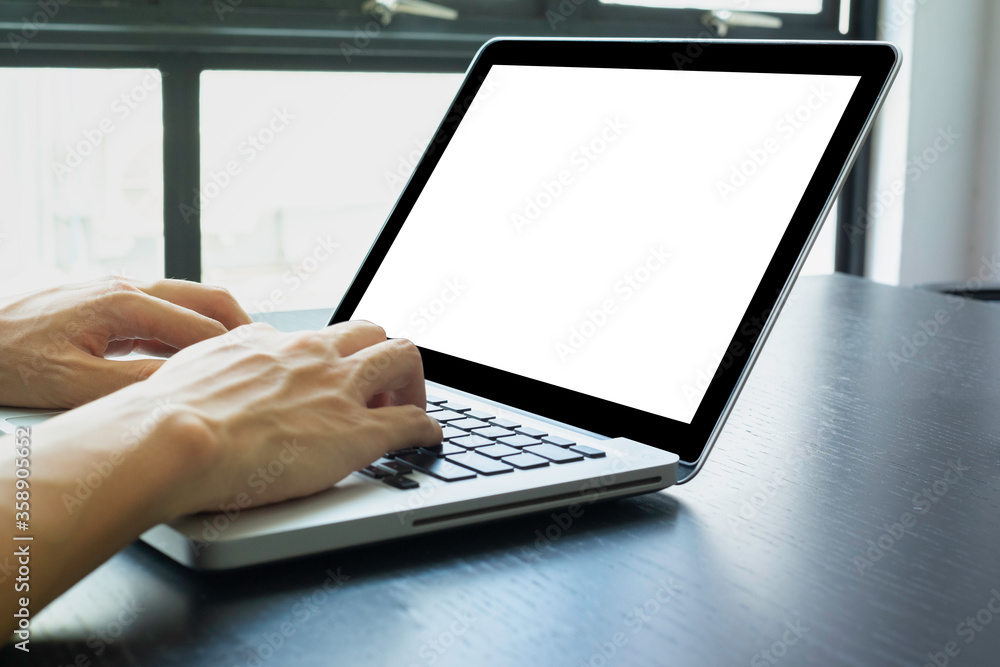 Hand typing on laptop or notebook keyboard at meeting room. isolated ...