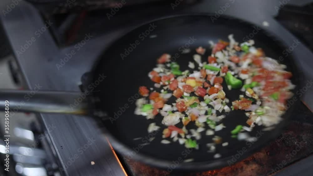 Cooking red sauce, with sauteed vegetables, caramelised onions, red ...