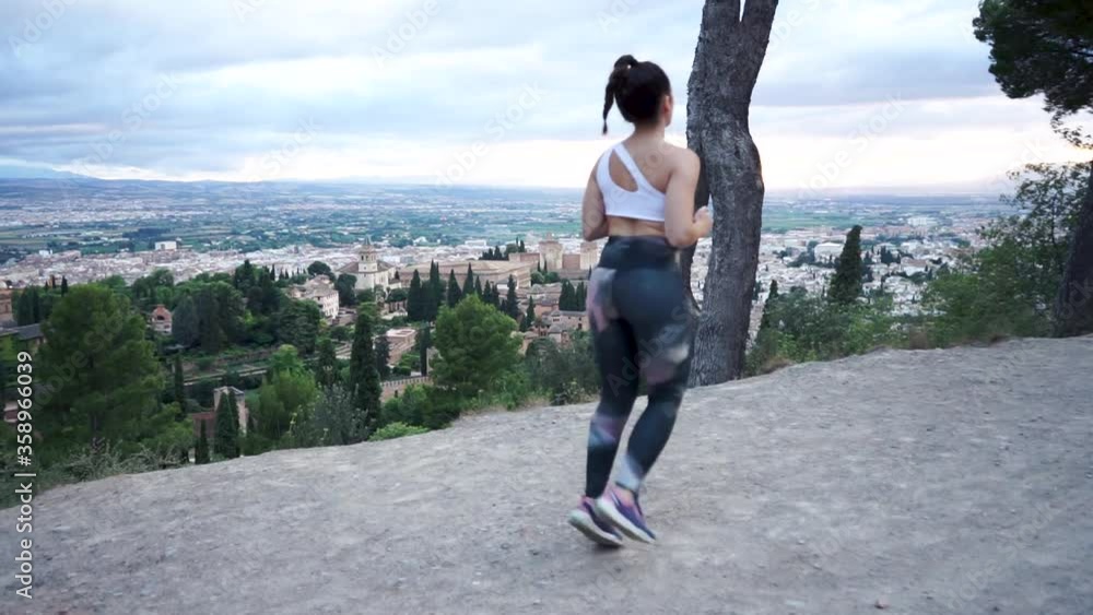 Young athlete woman running on location. Slow motion female athlete ...