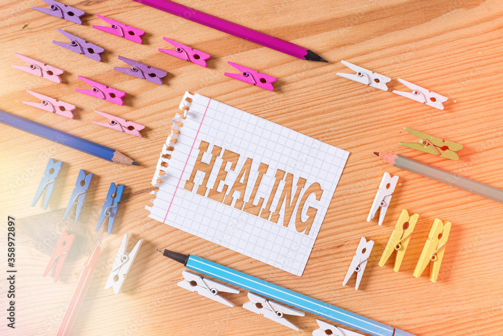 Writing note showing Healing. Business concept for process of the ...