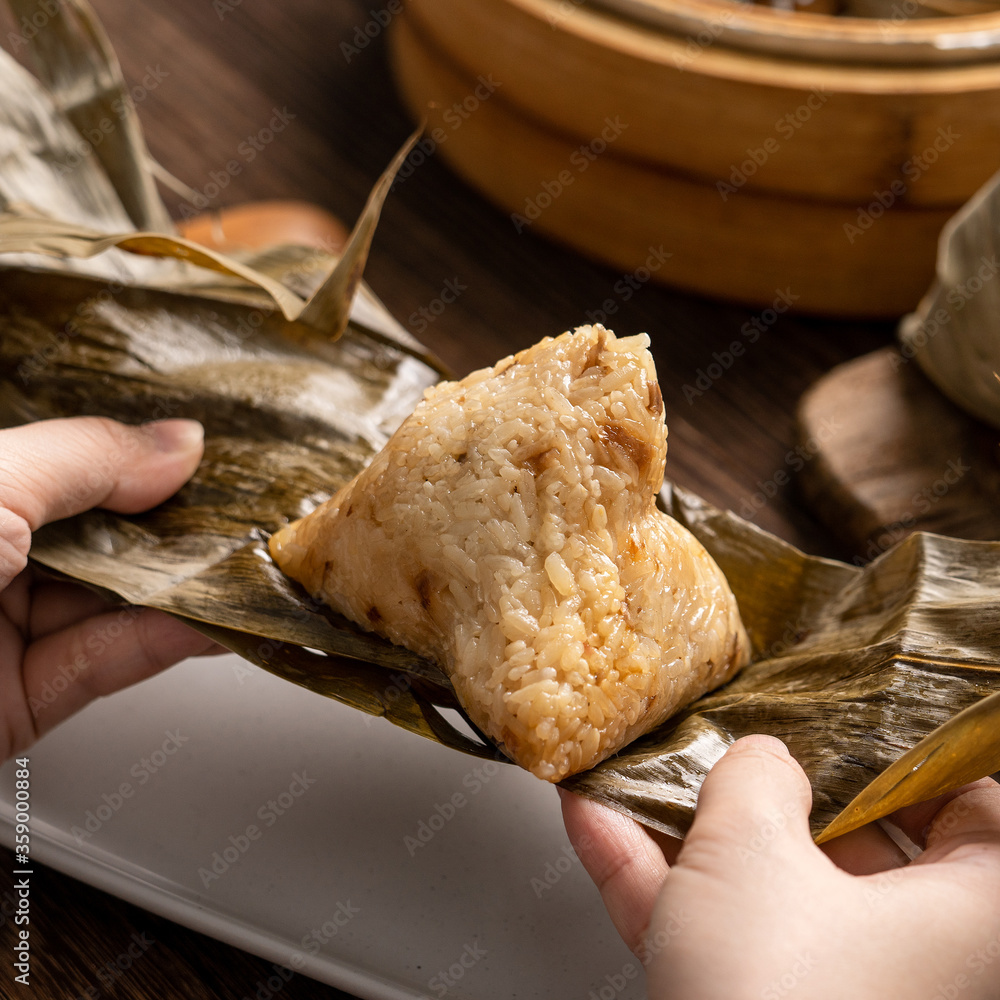 Eating zongzi - Dragon Boat Festival Rice dumpling young Asian woman ...