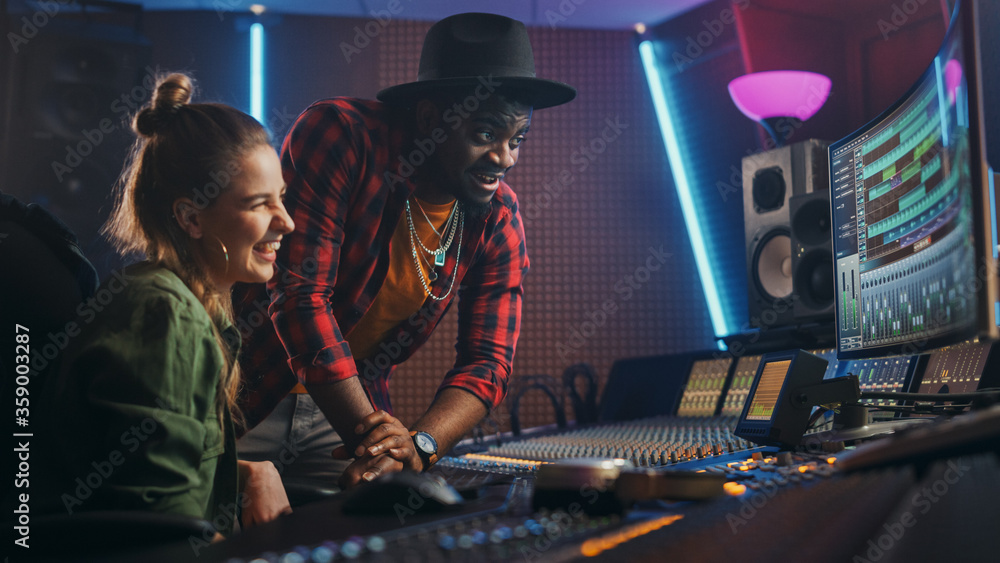 Stylish Producer and Audio Engineer Working together in Music Recording ...