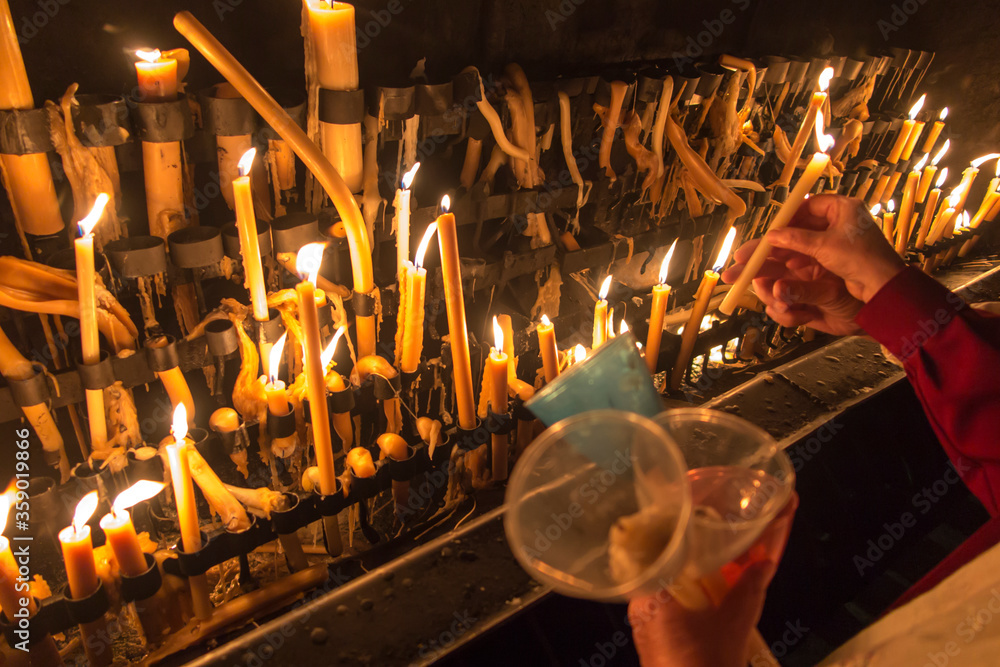 lighted candles at the Marian shrine in Fatima Stock Photo | Adobe Stock