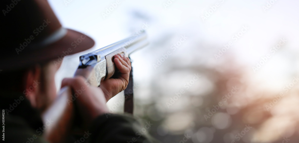 Shooter is on the hunting. Hunt prey rifle. Hunter man aiming on birds ...