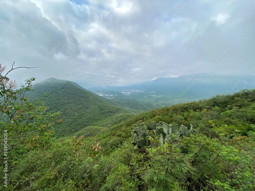 Man watching and enjoying the landscape on the hill of "El Chupon" in ...