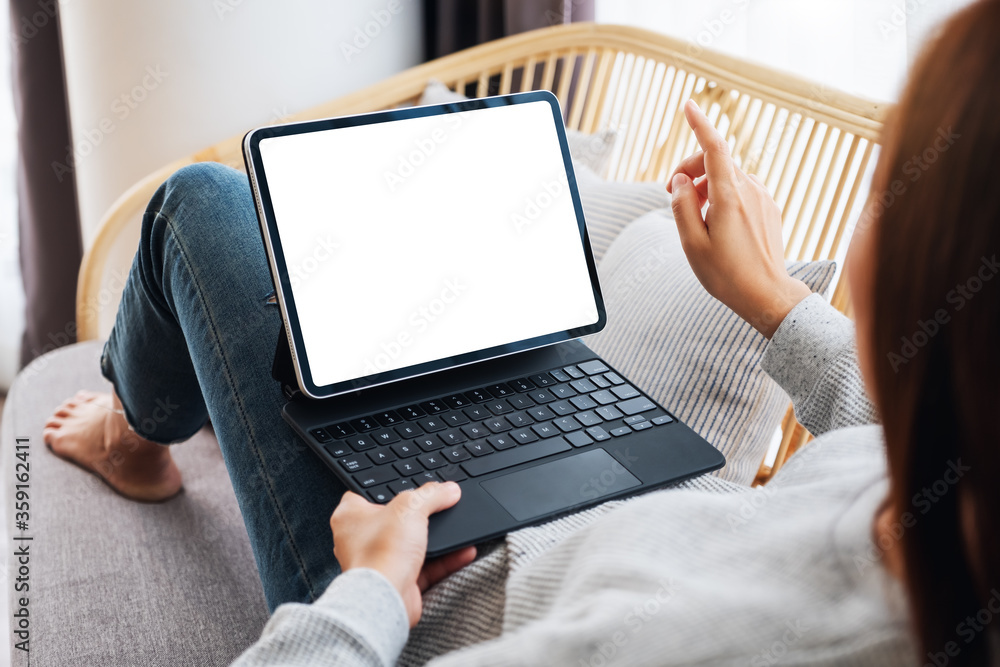 Mockup image of a woman using black tablet pc with blank desktop white ...